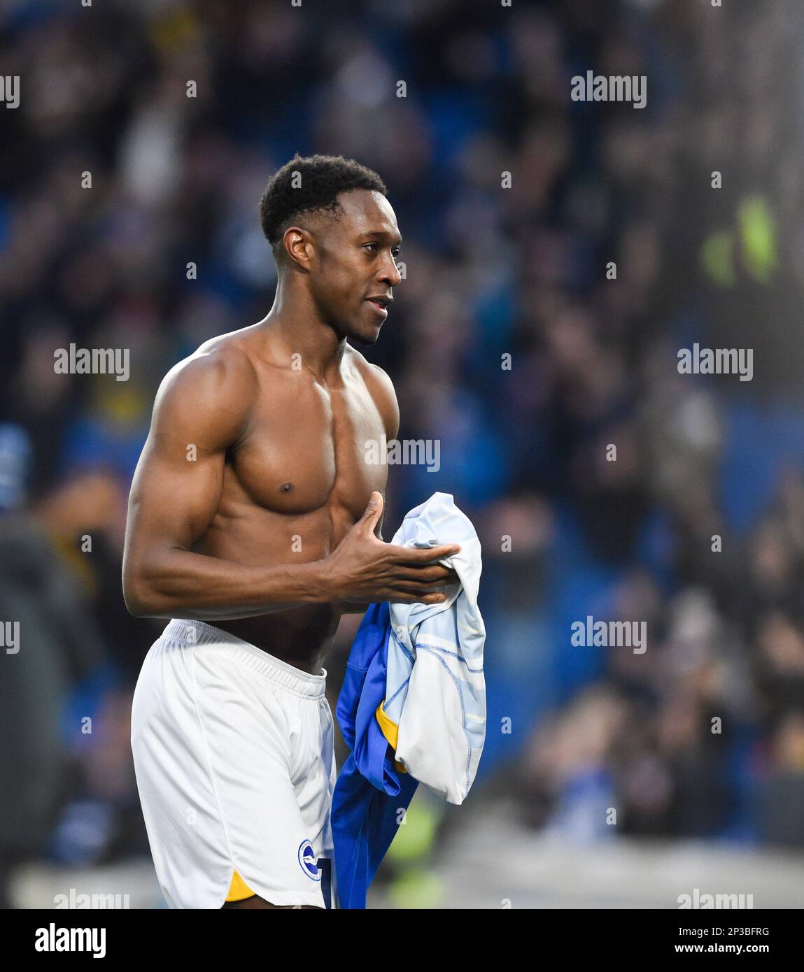 Danny Welbeck of Brighton about to give his shirt to fans during the ...