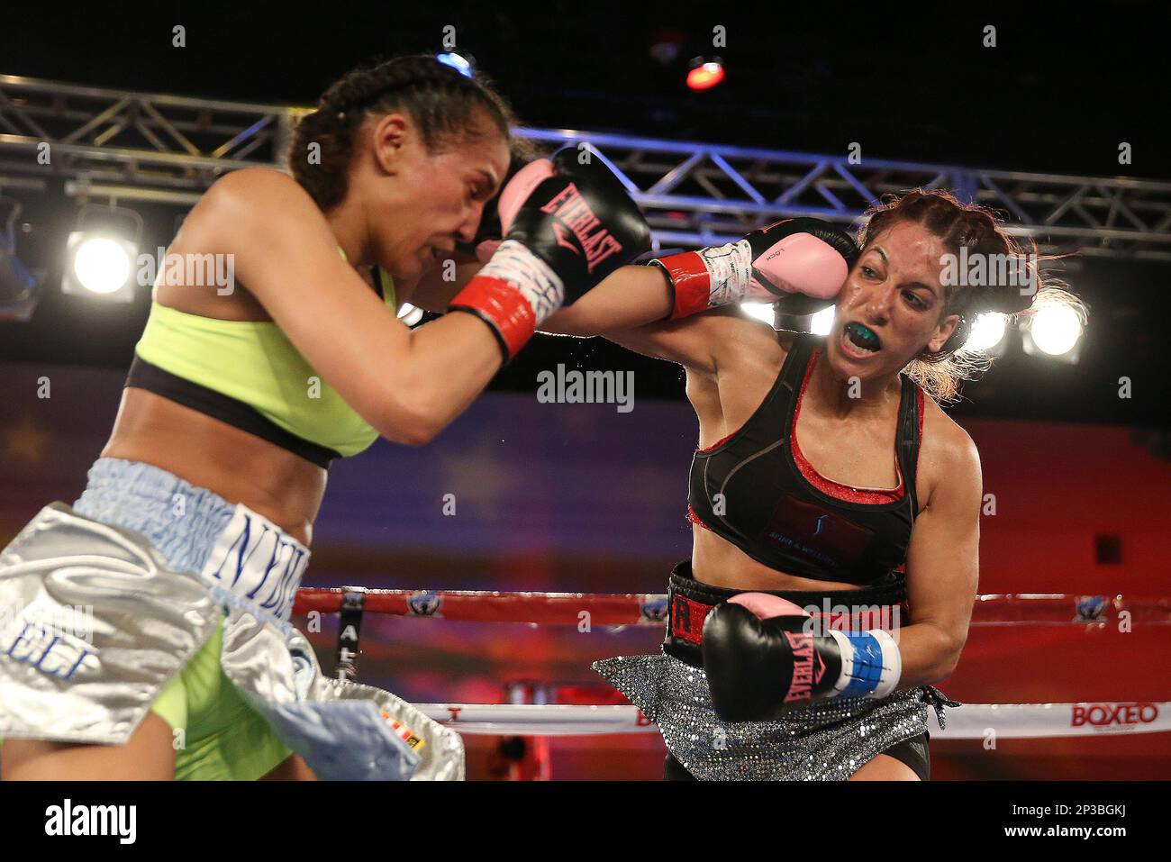 Noemi Bosques (R) throws a right hand against Nydia Feliciano during a ...