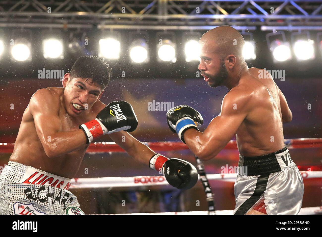 Ricardo Rodriguez (L) and Jonathan Vidal trade blows during a Telemundo ...