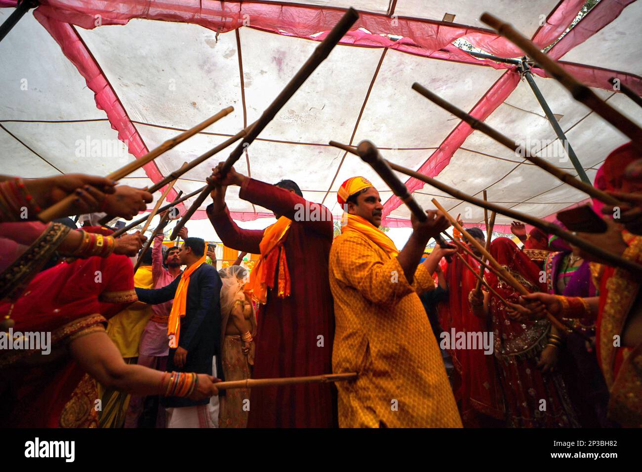 Mathura, India. 04th Mar, 2023. Hindu devotees are seen playing with ...