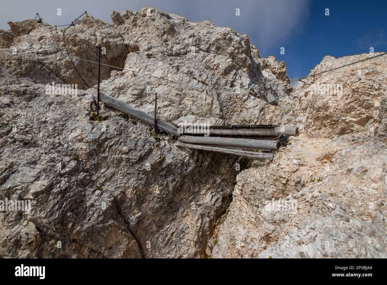 Elements set by man to facilitate the route via ferrata. Dolomites ...
