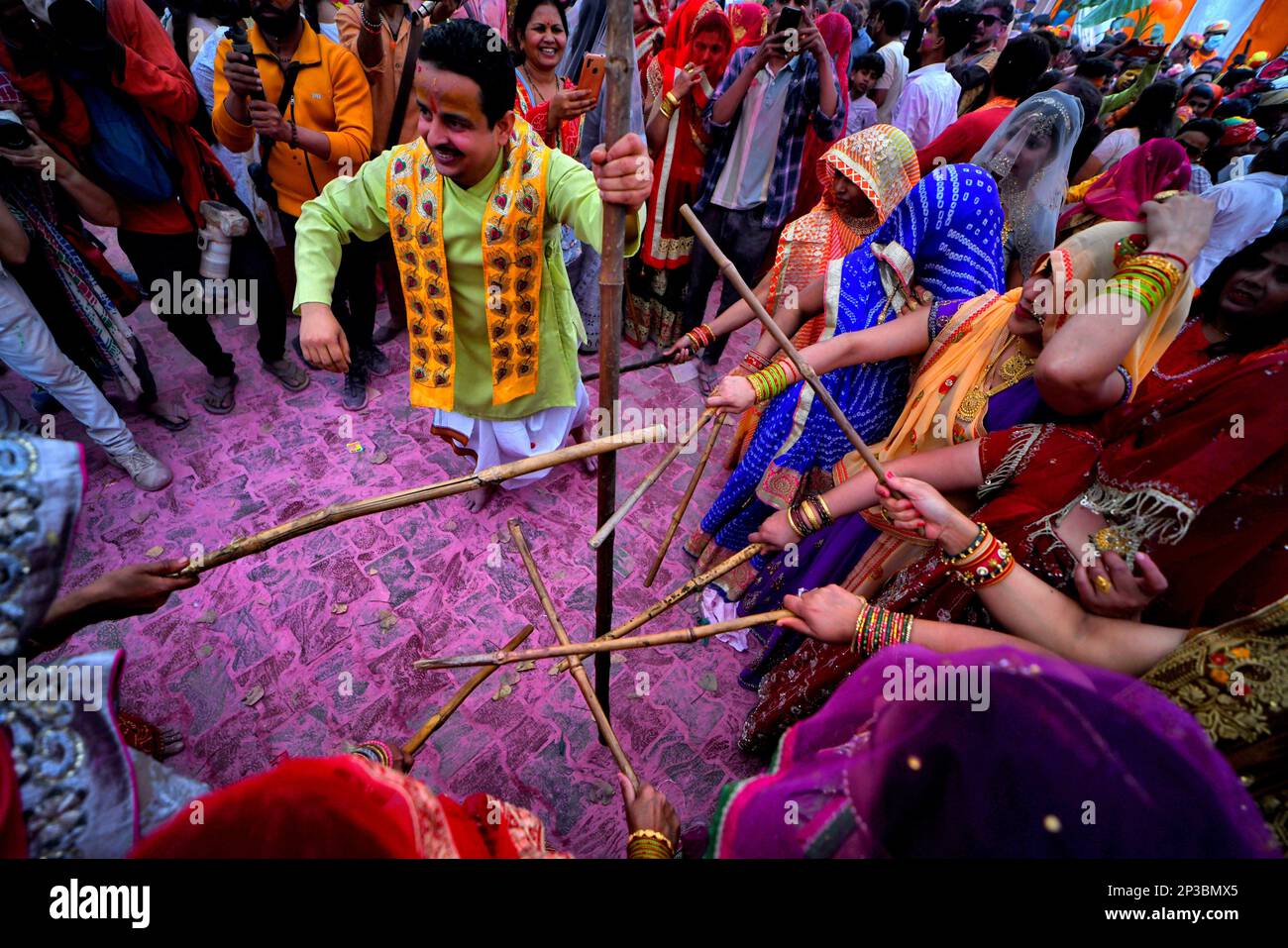 Hindu devotees are seen playing with sticks called Chaddi during the ...