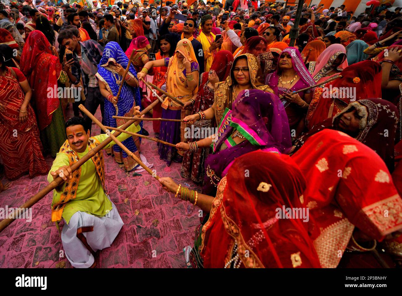 Mathura, India. 04th Mar, 2023. Hindu devotees are seen playing with ...