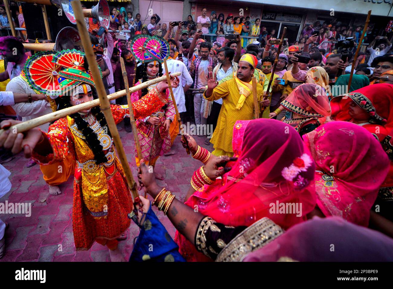 Mathura, India. 04th Mar, 2023. Hindu devotees are seen playing with ...