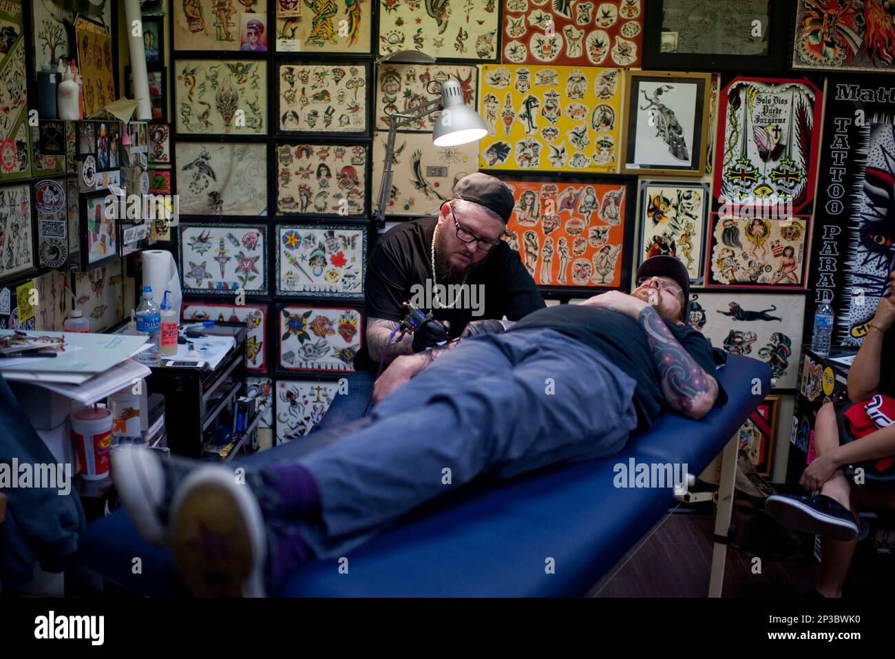 UNITED STATES - APRIL 19: Tattoo artist Matt Knopp tattoos an octopus ...