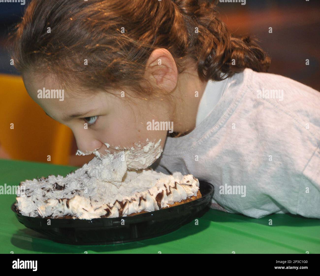 Students at Holy Family Academy participate in a pie eating competition ...