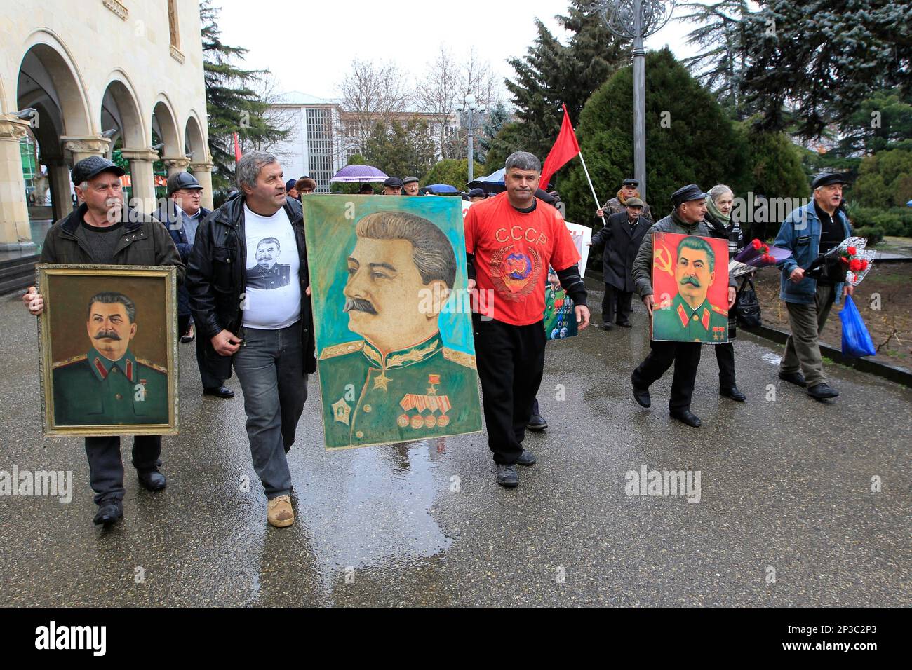 Georgians carry portraits of former Soviet dictator Joseph Stalin and ...