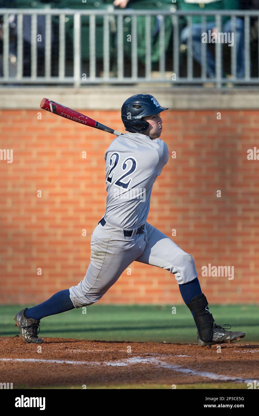 Grayson Lewis (22) of the Rice Owls follows through on his swing ...