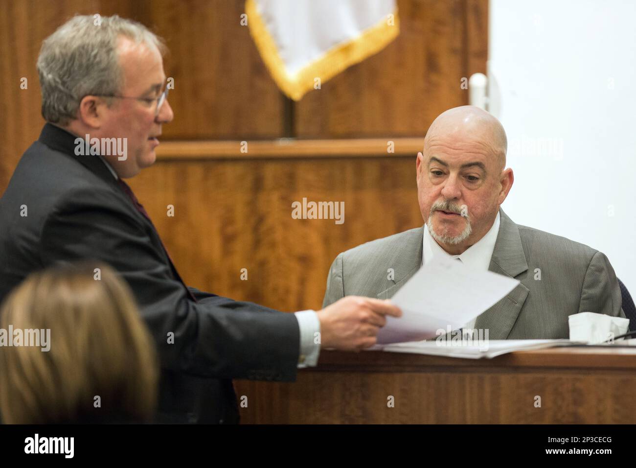 Prosecutor Patrick Bomberg, left, questionsChristopher Ritchell of AT&T ...