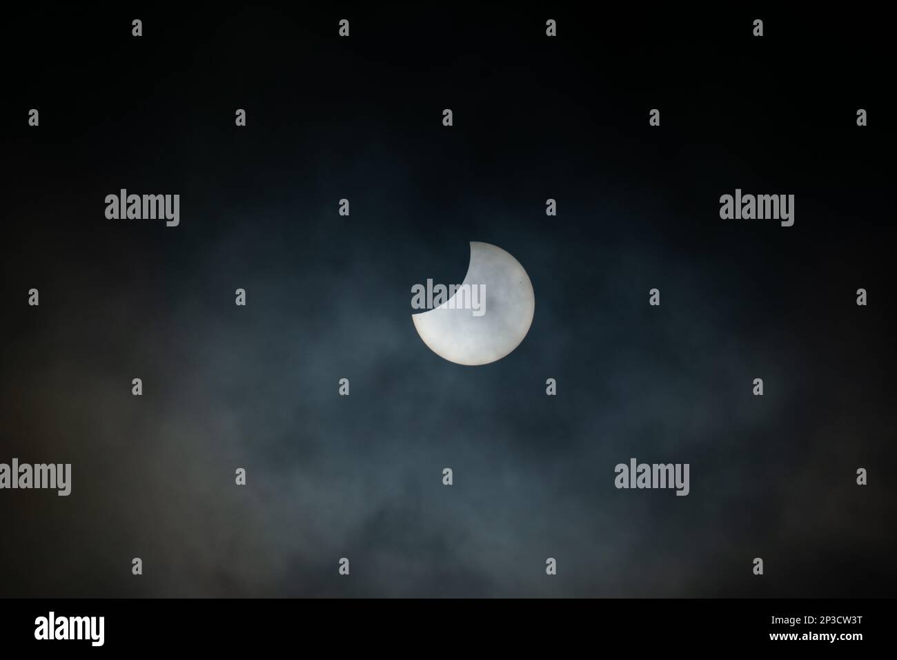 Partial Solar Eclipse on a Cloudy Day Stock Photo - Alamy