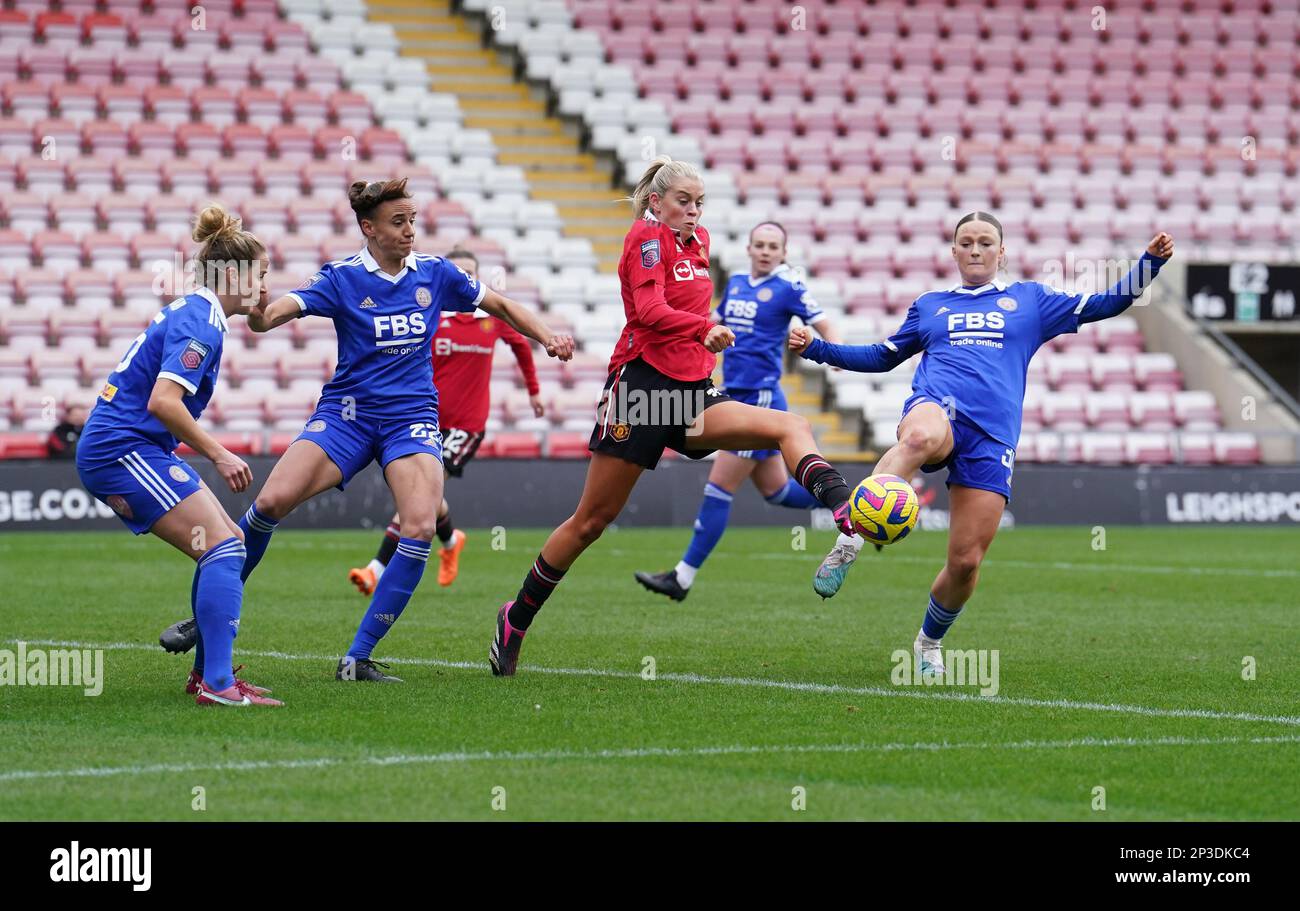 Manchester United's Alessia Russo (centre) battles for the ball with ...