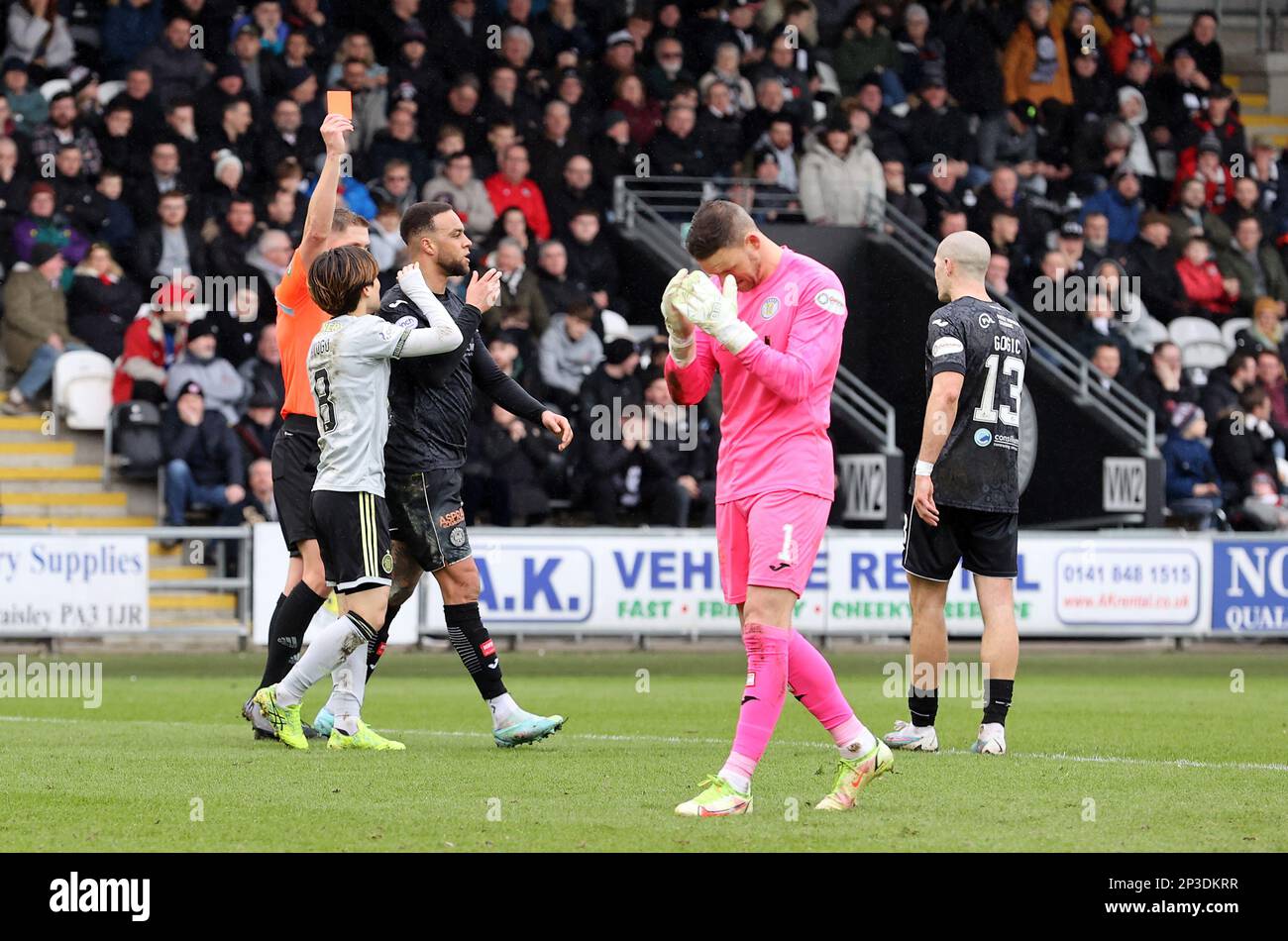 St Mirren's Charles Dunne is shown a red card by referee David ...