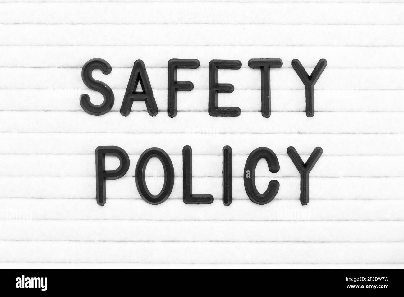 Black color letter in word safety policy on white felt board background ...