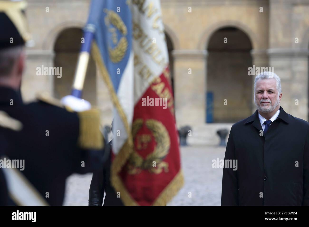 Quebec prime minister Philippe Couillard reviews an honor guard during ...