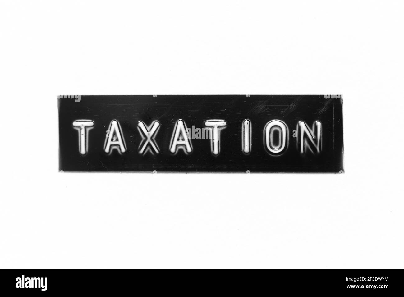 Black color banner that have embossed letter with word taxation on ...