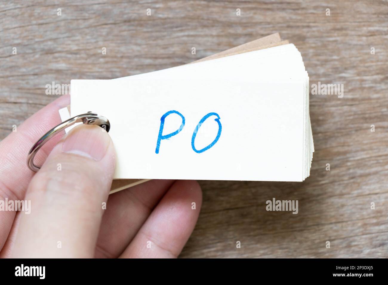 Hand hold flash card with handwriting in word PO (Abbreviation of ...