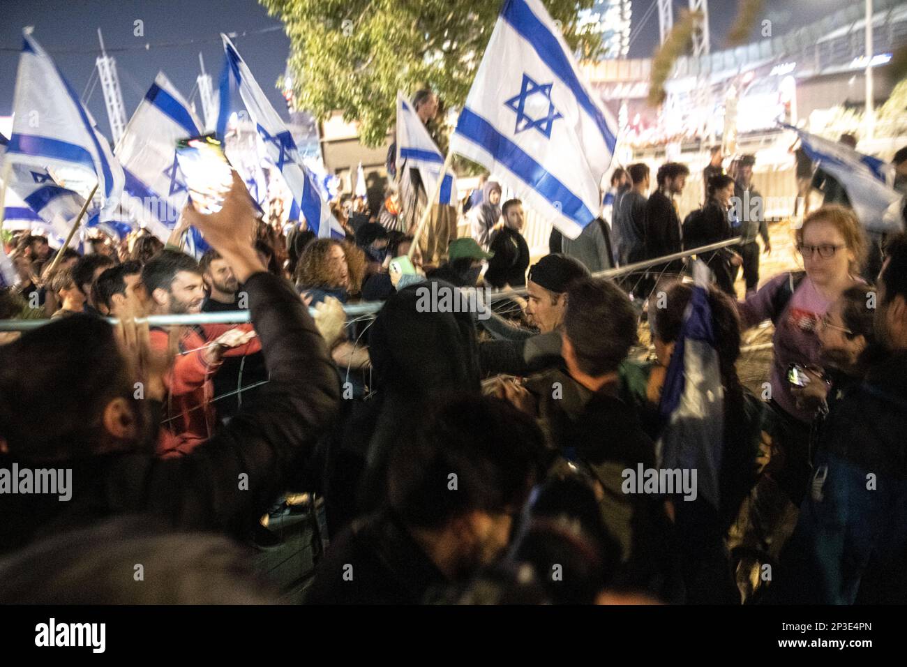 Israeli Protestors Against The Reform Pull Down A Fence As They March