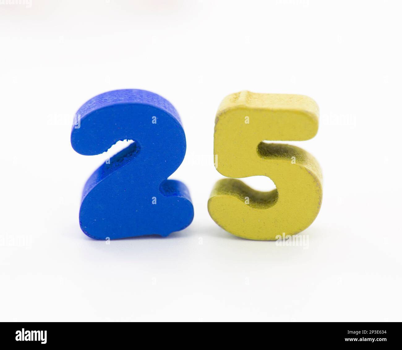 25 colorful wooden numbers decorative on the white Stock Photo - Alamy