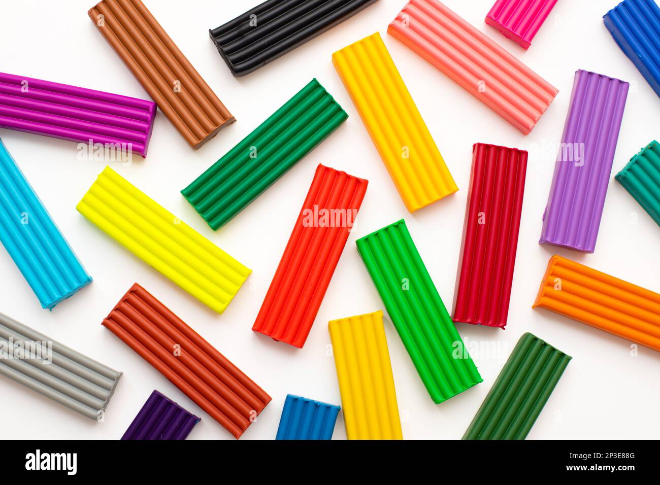 plasticine modeling clay sticks on white background. pattern, top view ...