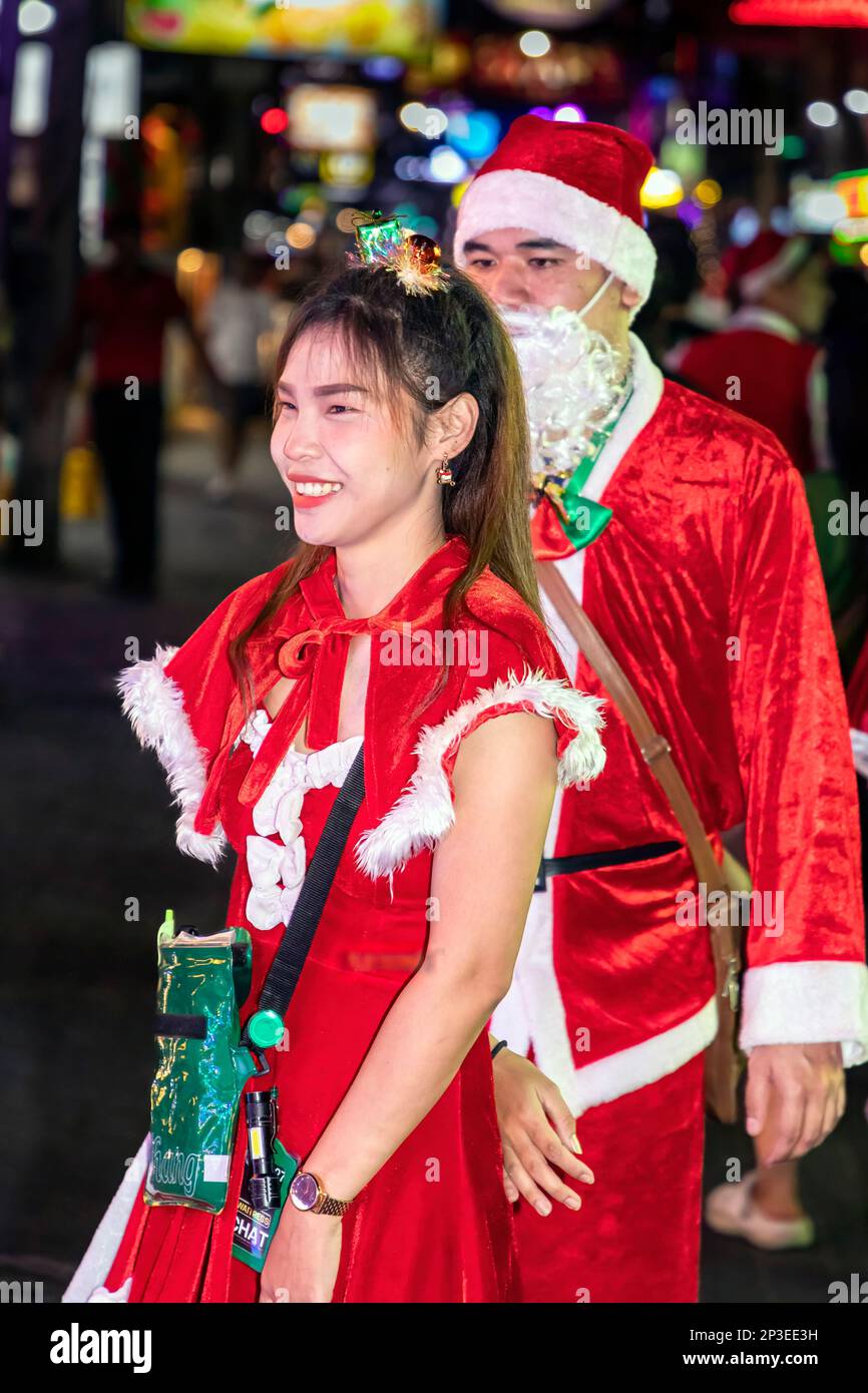 Thai Santa Clause with bar receptionist in Christmas outfit, Walking ...