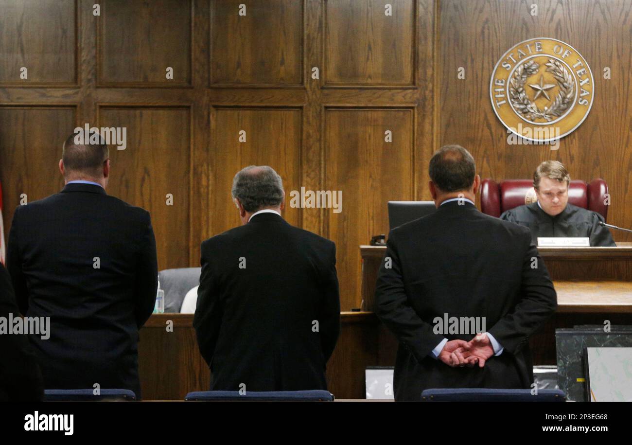 State District Judge Jason Cashon, right, reads the sentence of guilty ...