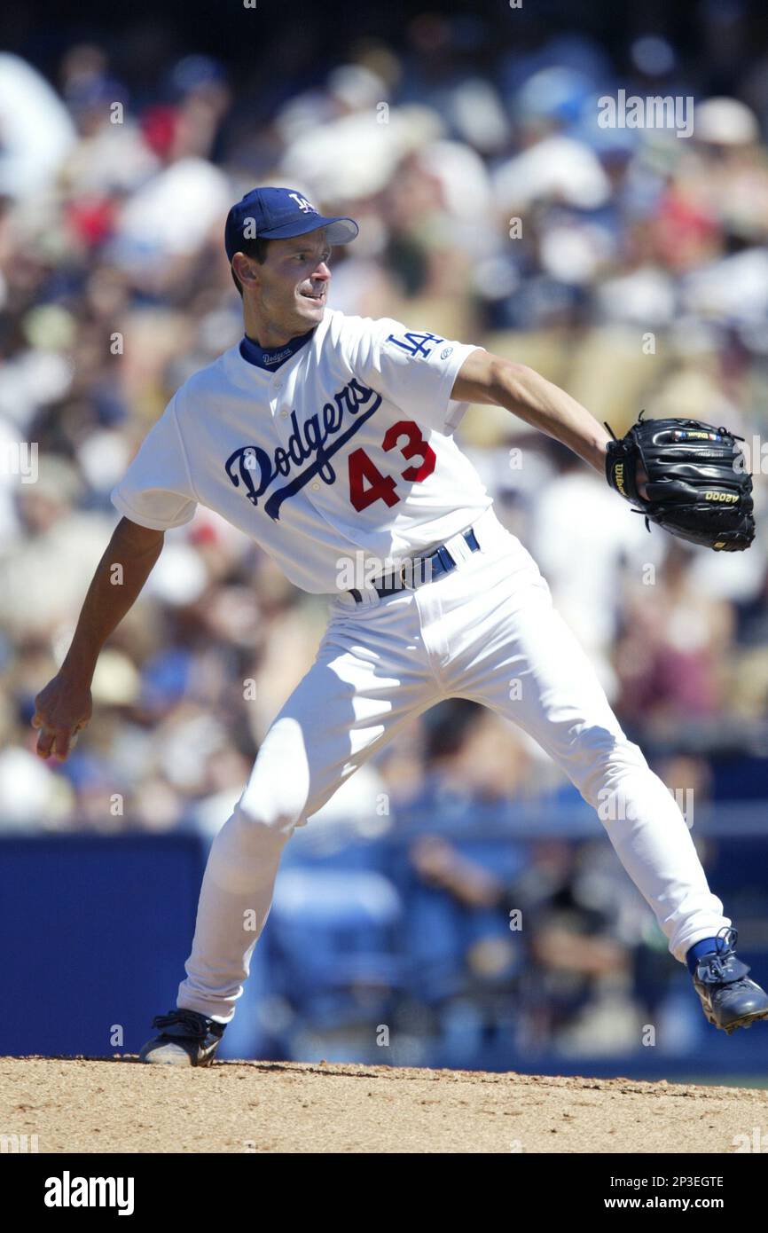 Andy Ashby of the Los Angeles Dodgers pitches during a 2002 MLB season ...