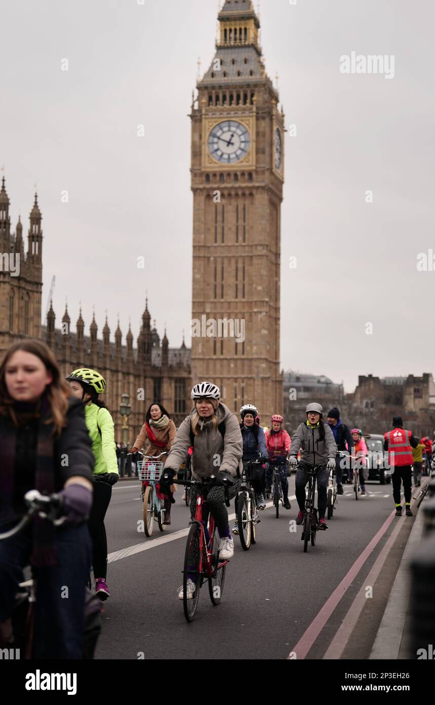 People cycle over Westminster Bridge as they take part in a protest ...