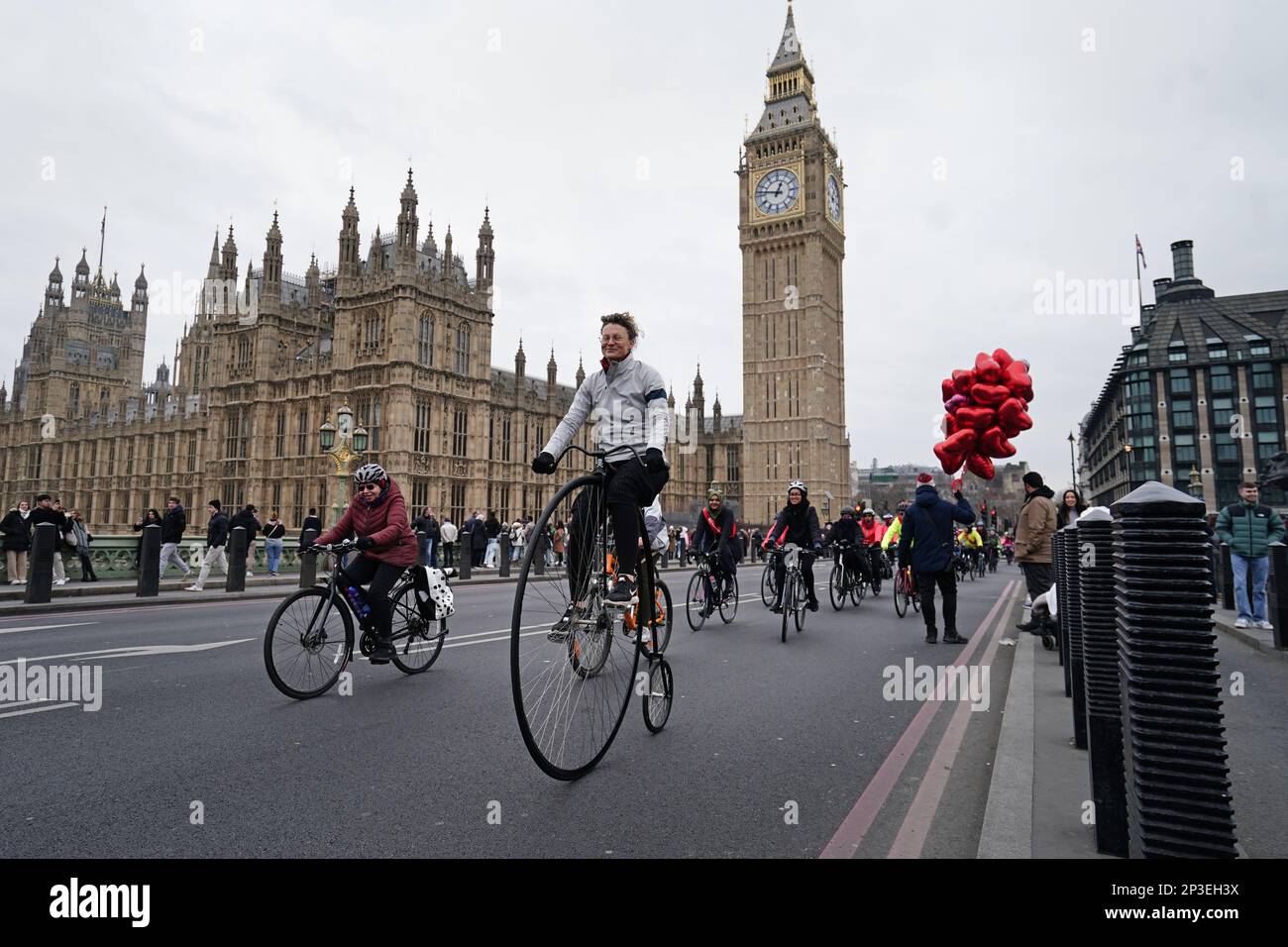 People cycle over Westminster Bridge as they take part in a protest ...