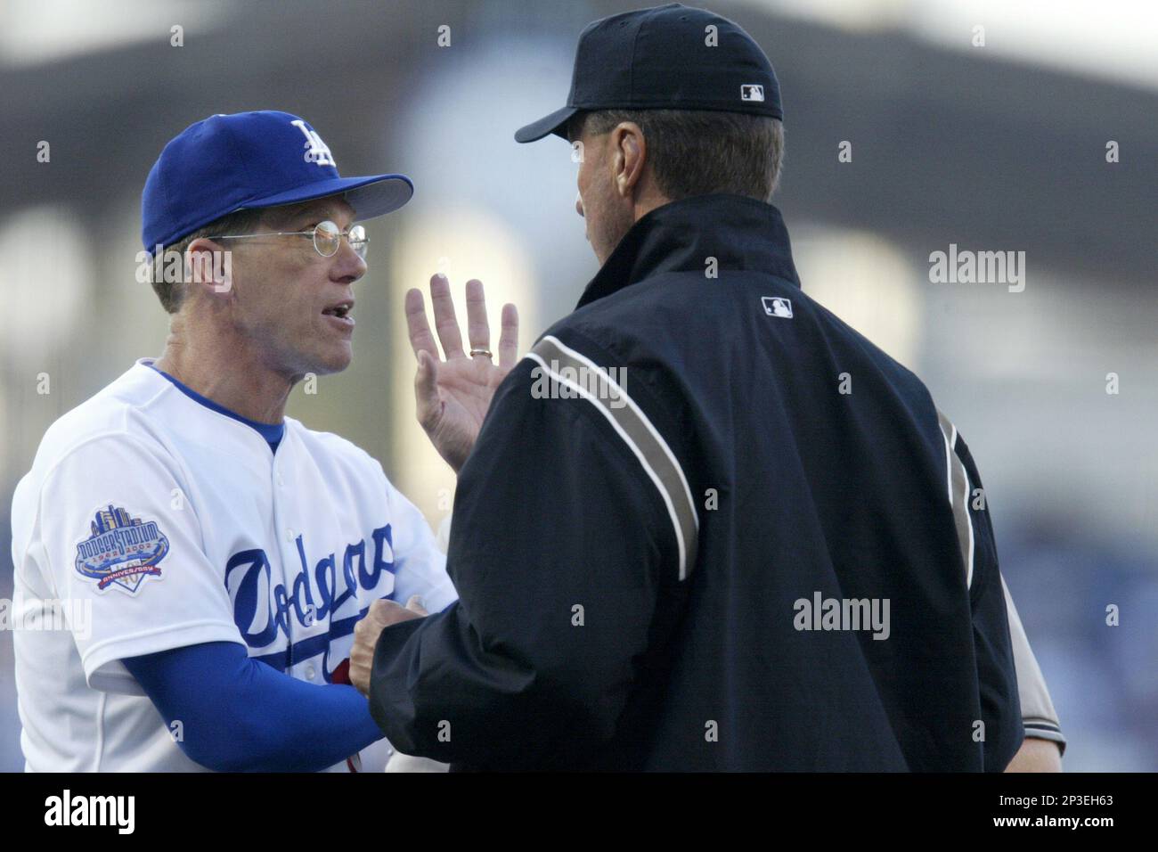 Los Angeles Dodgers Manager Jim Tracy argues with a umpire during a ...