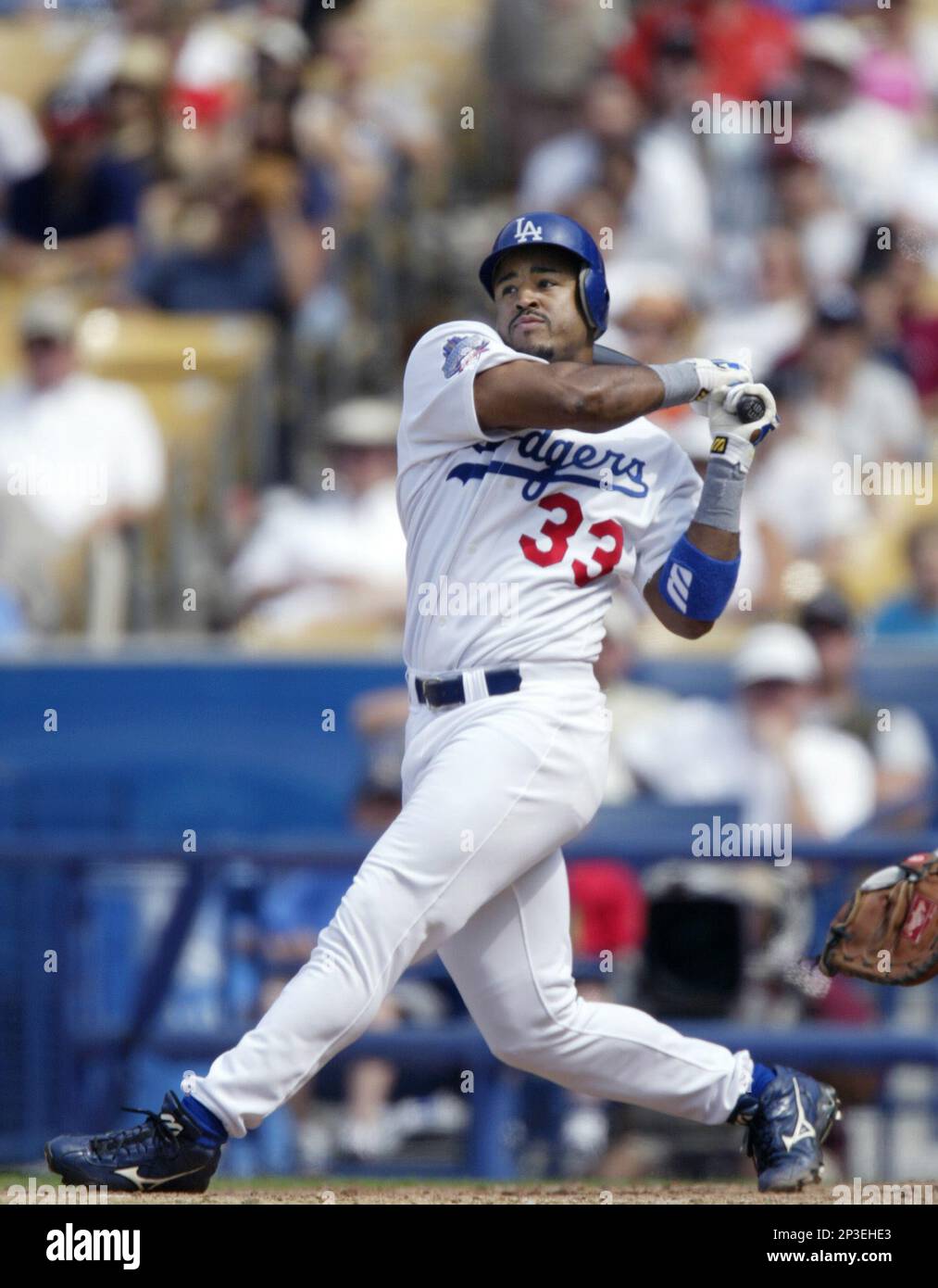 Brian Jordan of the Los Angeles Dodgers bats during a 2002 MLB season ...