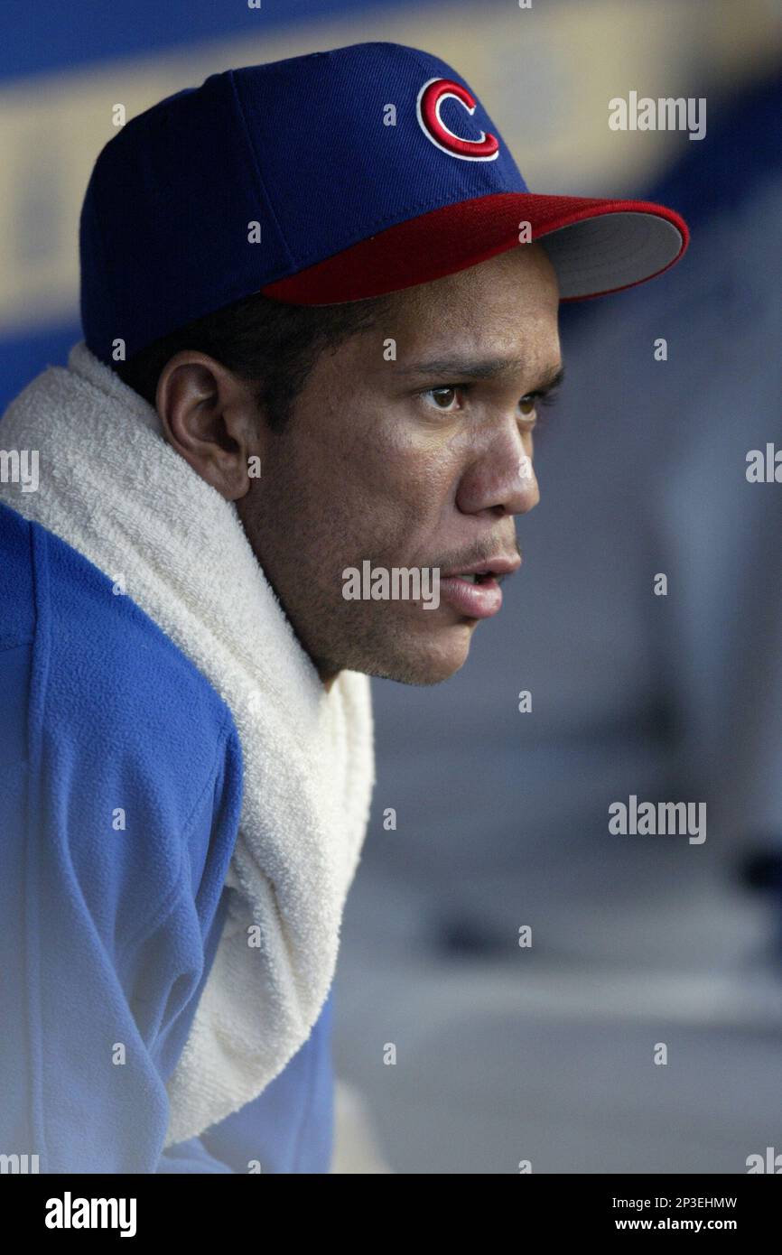 Juan Cruz of the Chicago Cubs sits in the dugout during a 2002 MLB ...