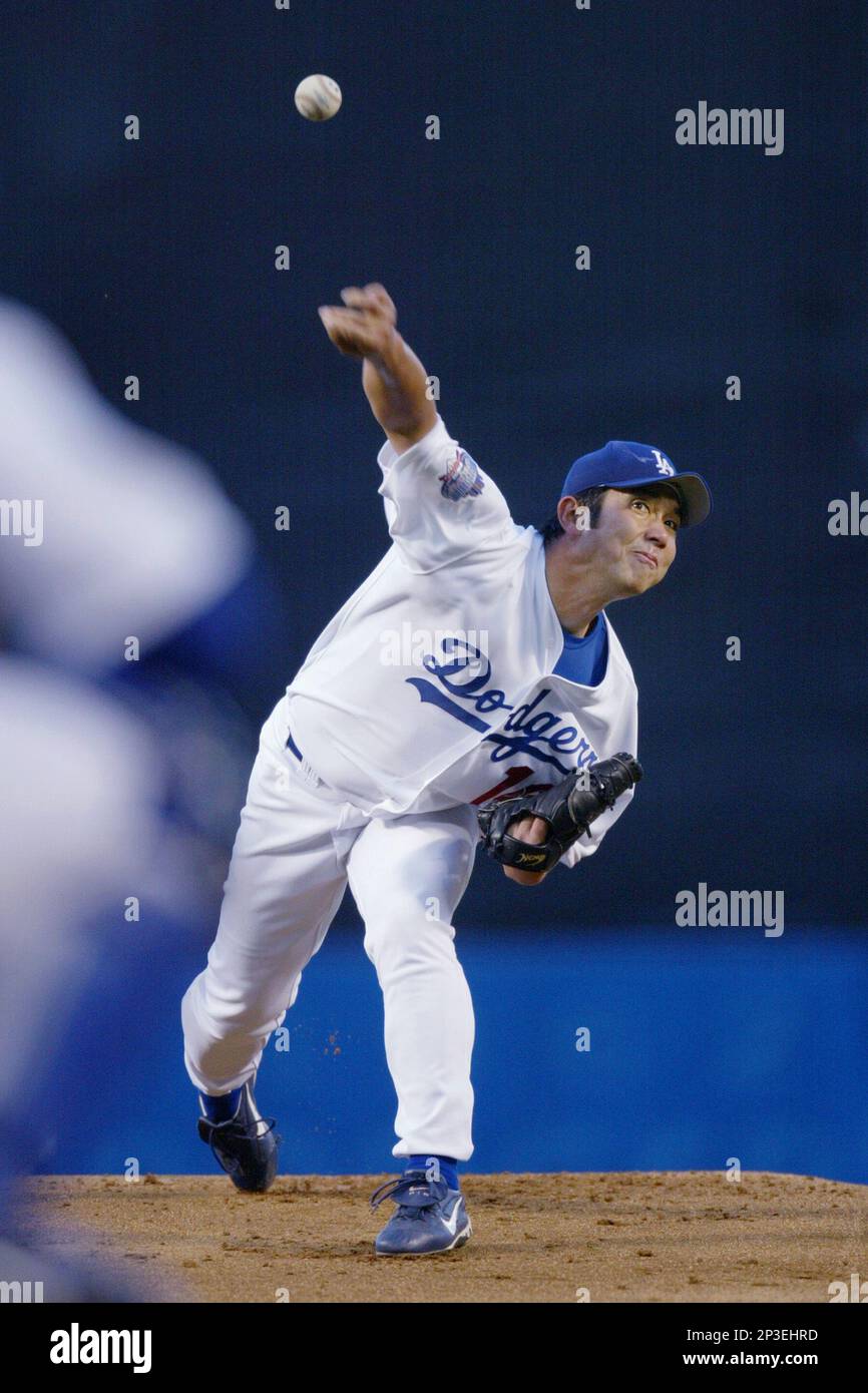 Hideo Nomo of the Los Angeles Dodgers pitches during a 2002 MLB season ...