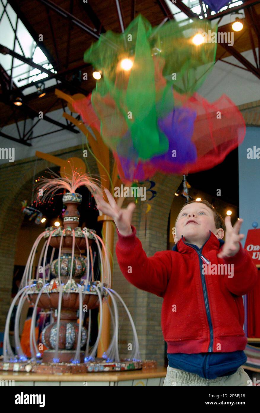 Troy Frysinger,4, from Michigan is reaching high to grab brightly ...