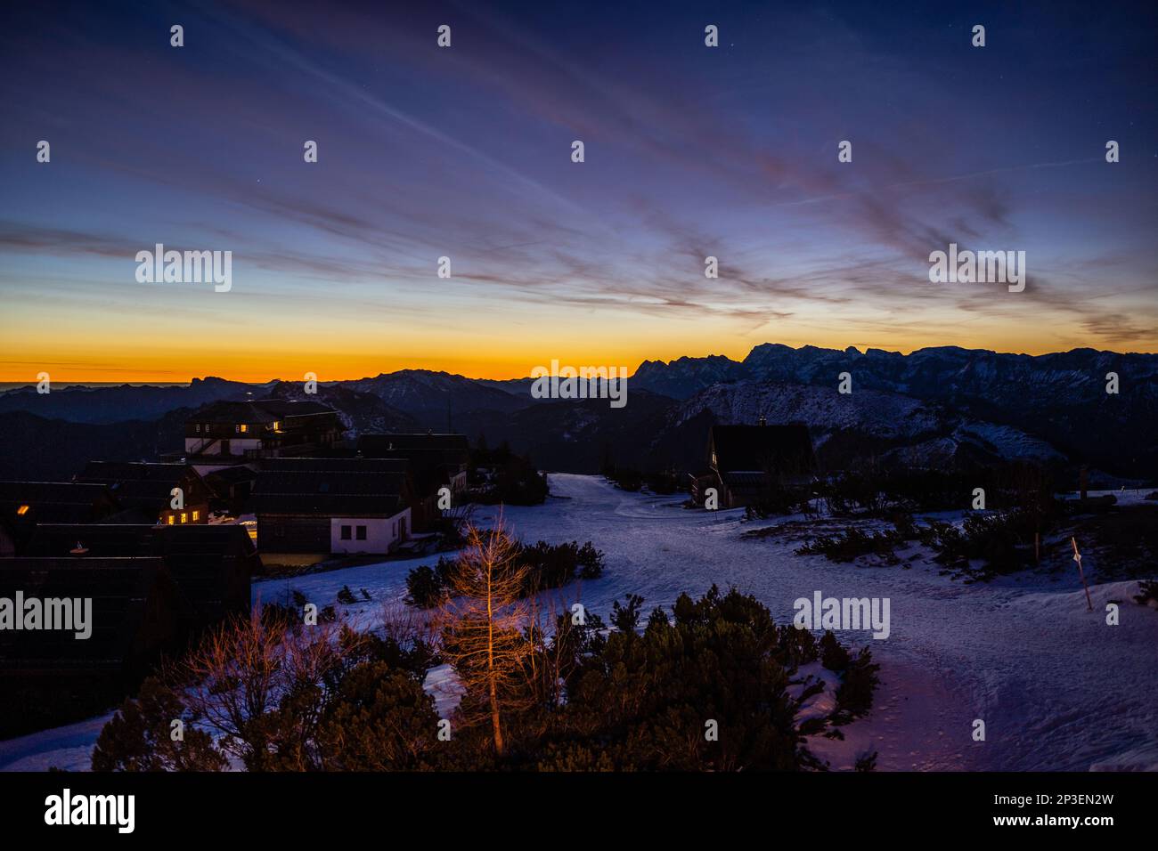 A new day dawns as the sun rise breaks the ridge of the mountains from ...