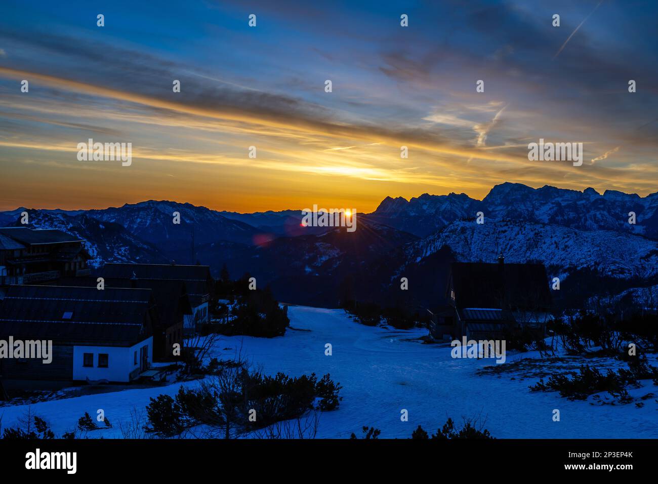 A new day dawns as the sun rise breaks the ridge of the mountains from ...