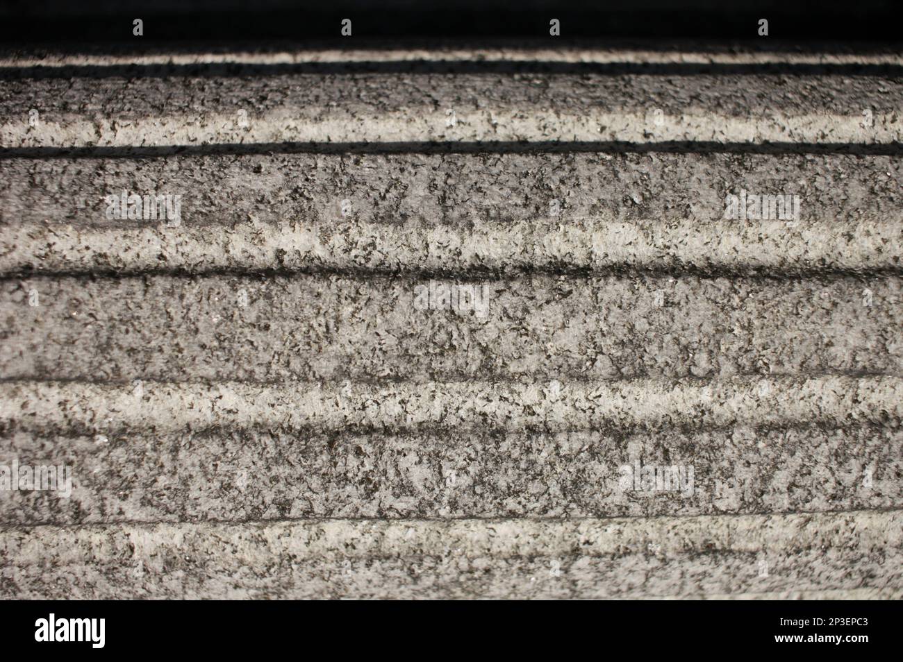 Horizontal lines carved into the natural stone wall Stock Photo - Alamy