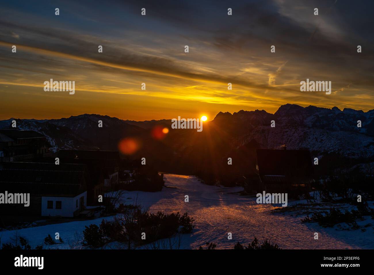 A new day dawns as the sun rise breaks the ridge of the mountains from ...