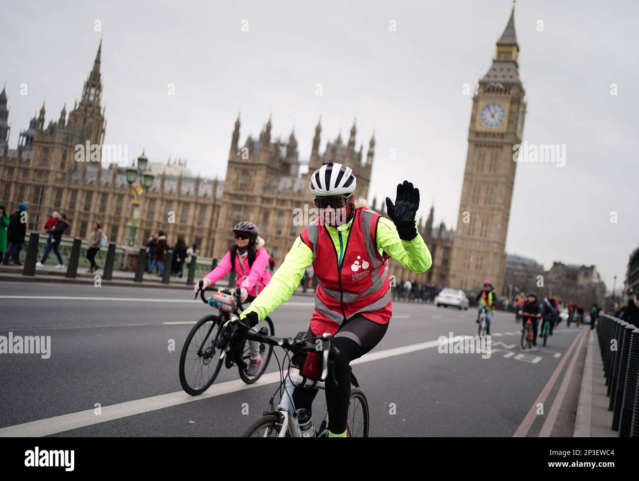 People cycle over Westminster Bridge as they take part in a protest ...