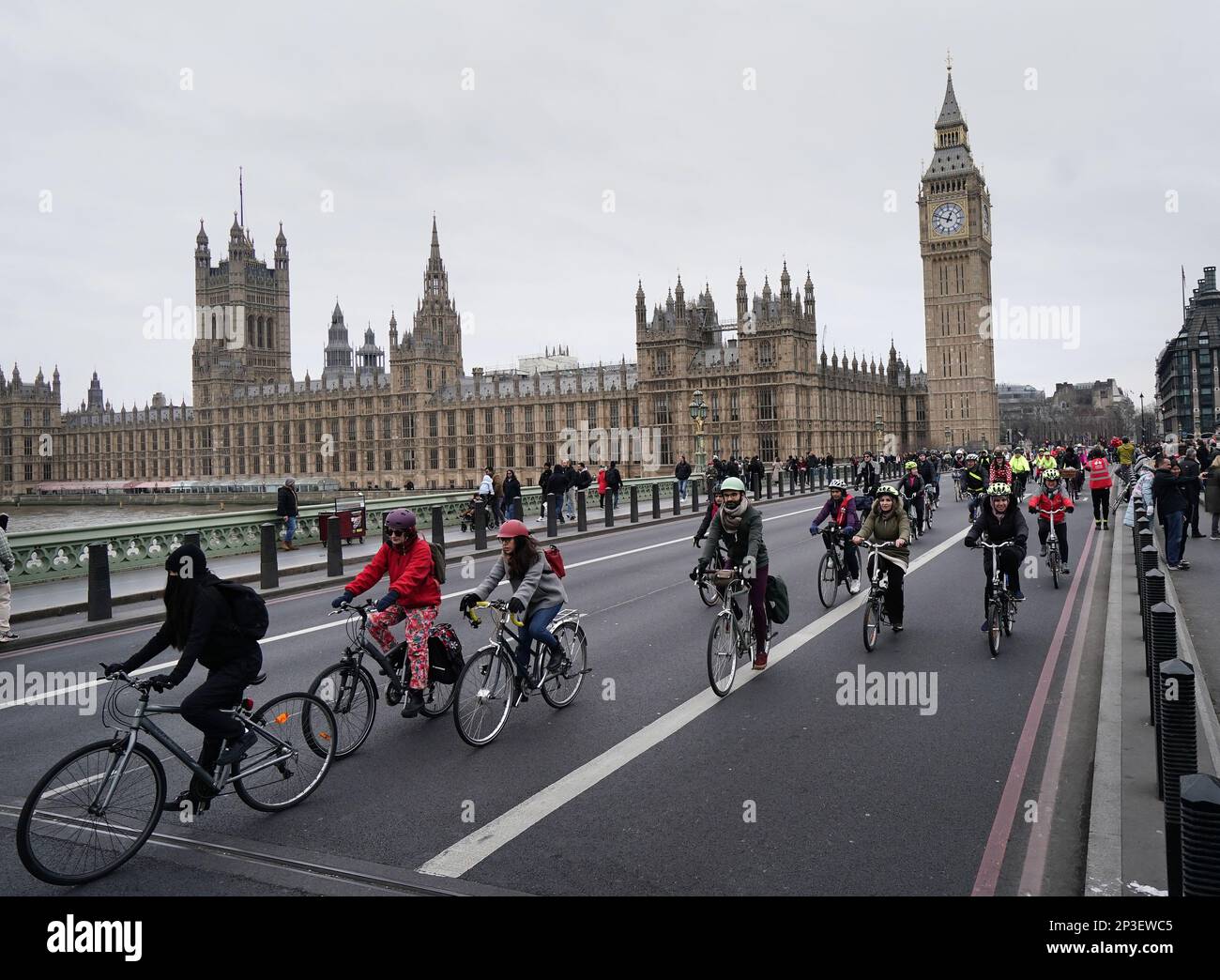 People cycle over Westminster Bridge as they take part in a protest ...