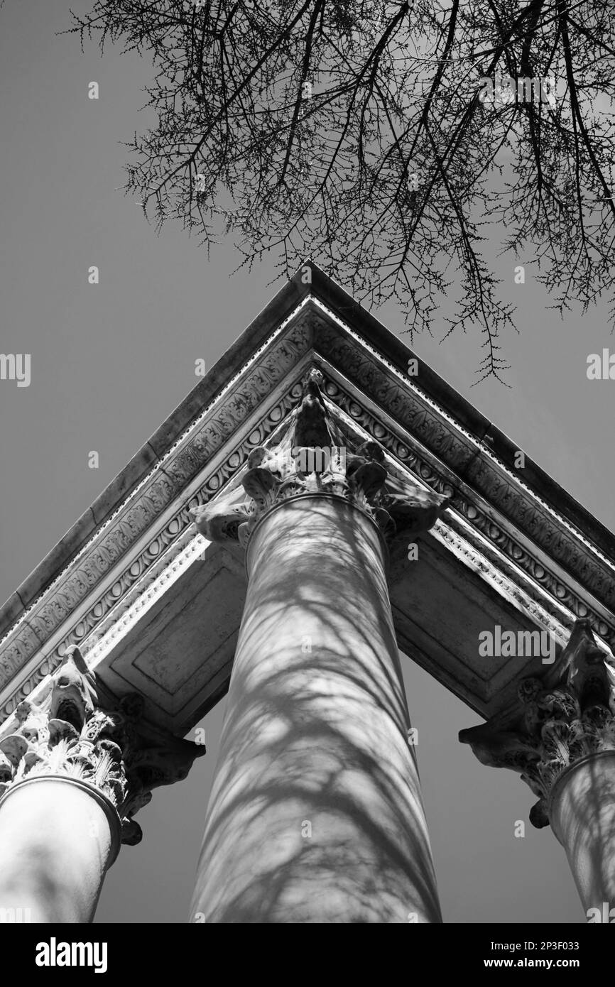 Looking up at an elaborate natural stone column with intricate ...