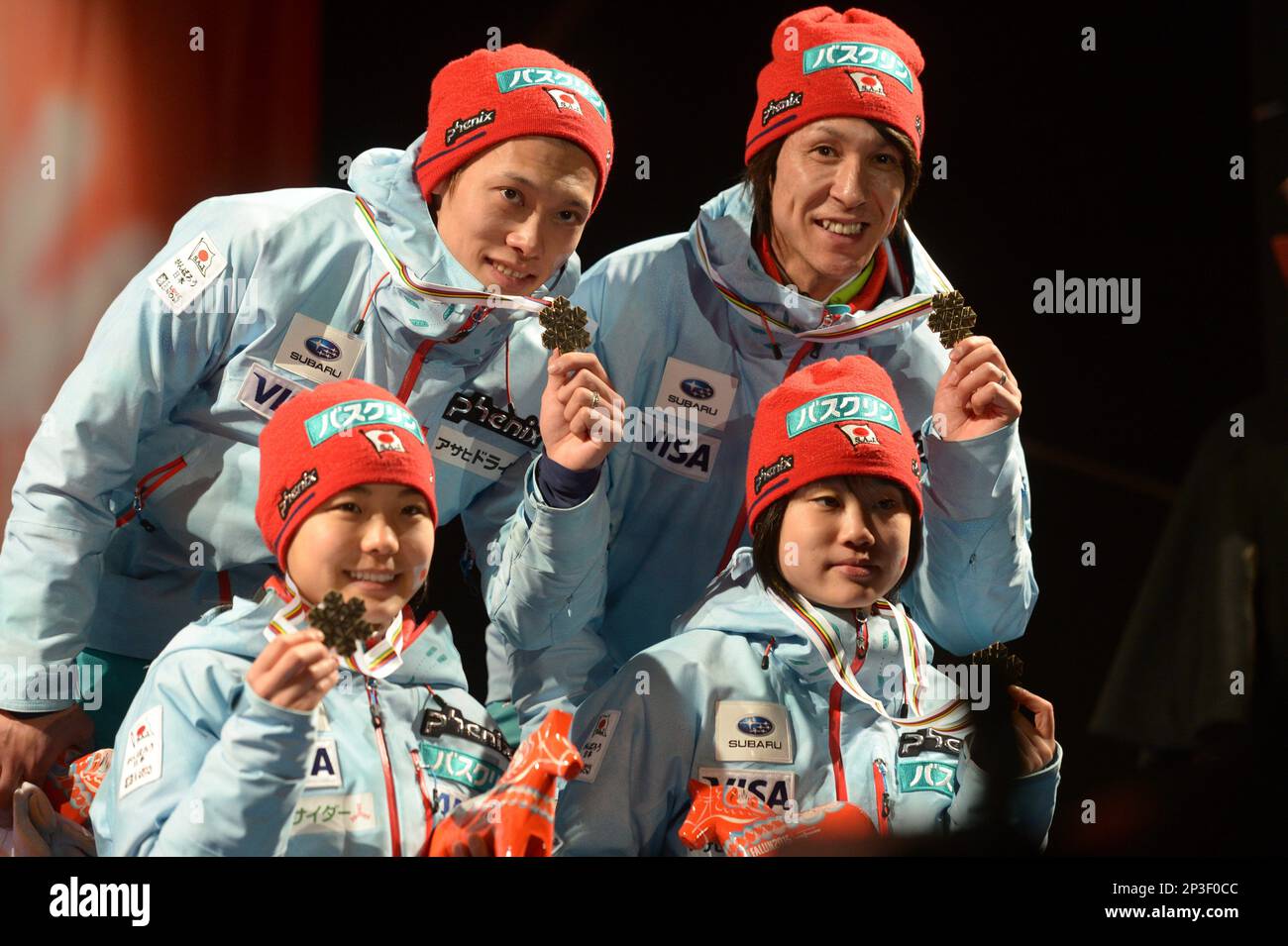 Japanese team members Taku Takeuchi, top left, Noriaki Kasai, top right ...
