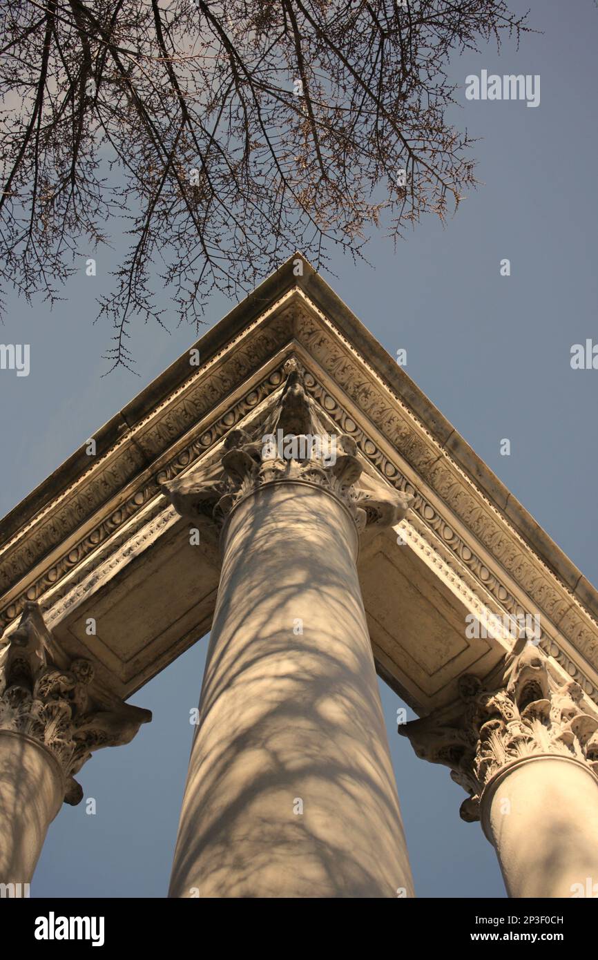 Looking up at an elaborate natural stone column with intricate ...