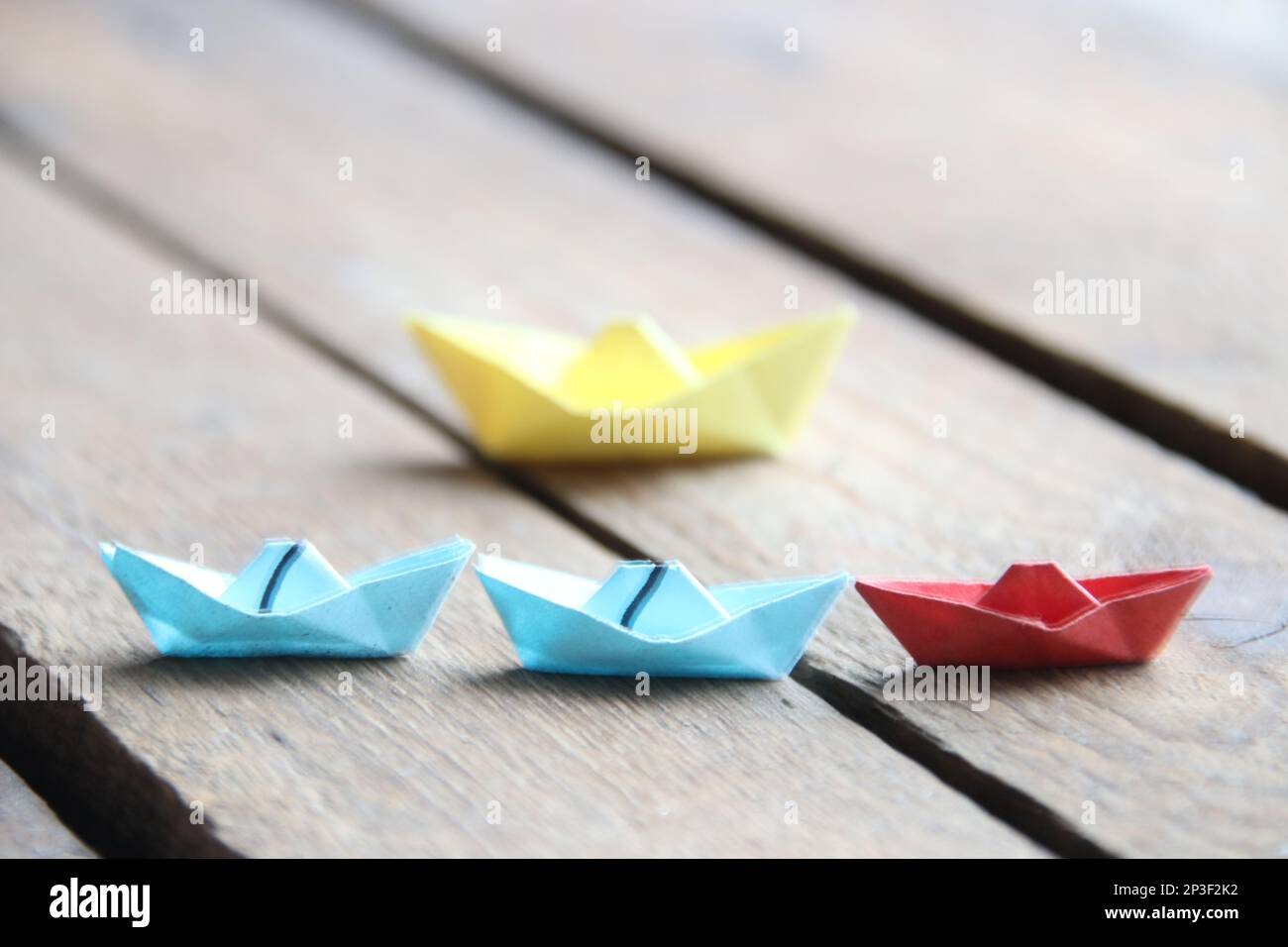 Leadership concept paper boats hi-res stock photography and images - Alamy