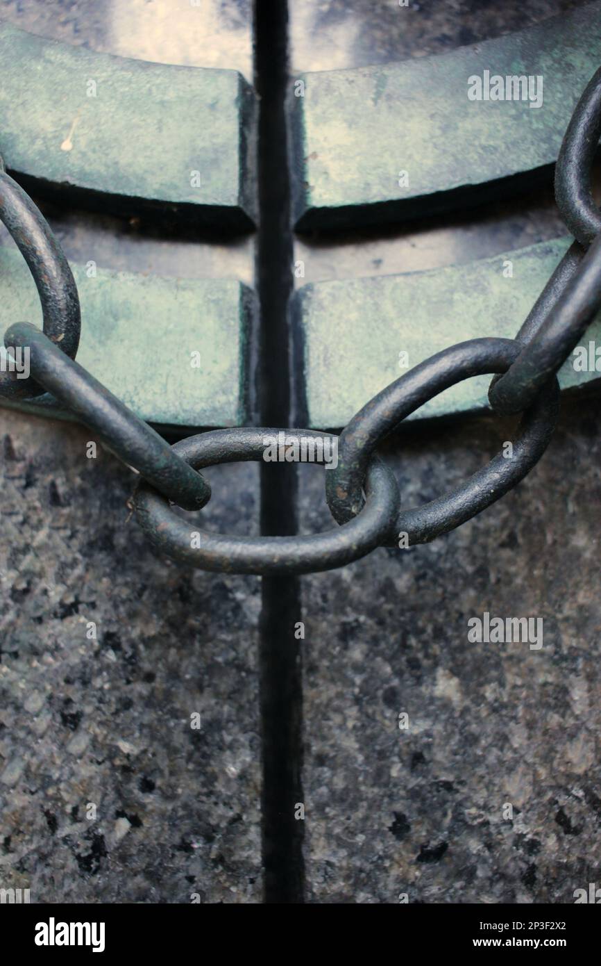 An iron metal chain hanging on the medieval gate Stock Photo - Alamy