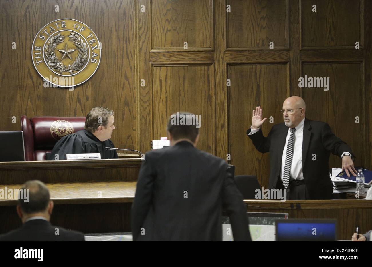 State District Judge Jason Cashon, top left, gives an oath to clinical ...