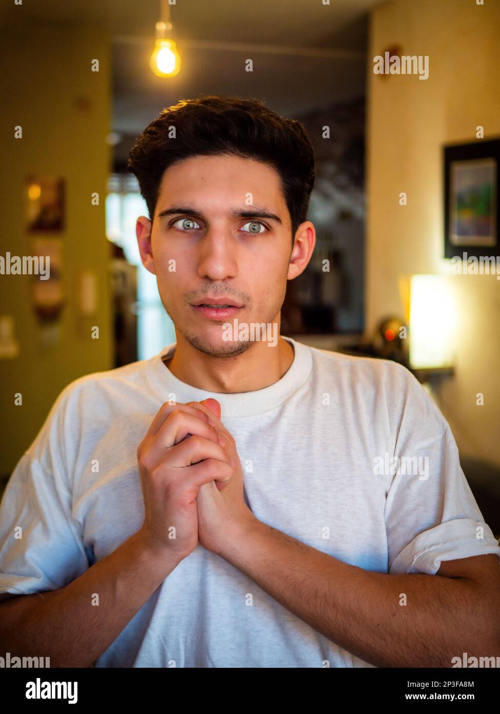 Surprised, scared, frightened, unsure handsome young man Stock Photo - Alamy