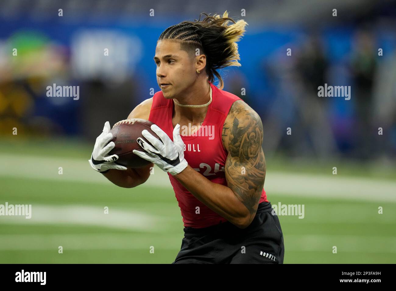 Princeton wide receiver Andrei Iosivas runs a drill at the NFL football ...