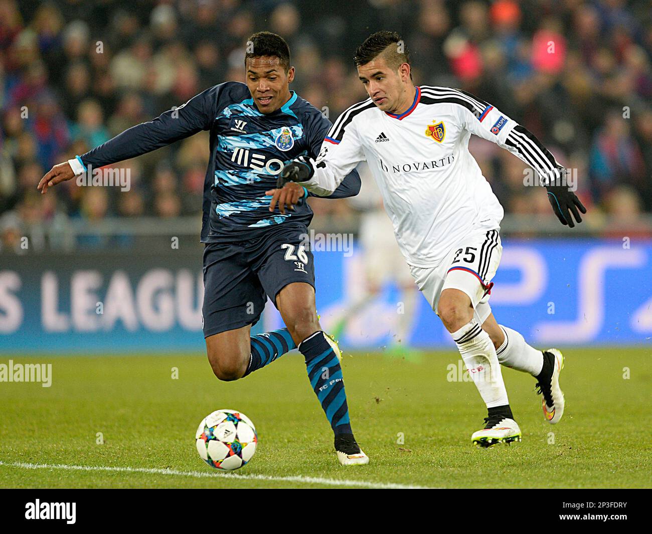 Porto's Alex Sandro, left, fights for the ball against Basel's Derlis ...