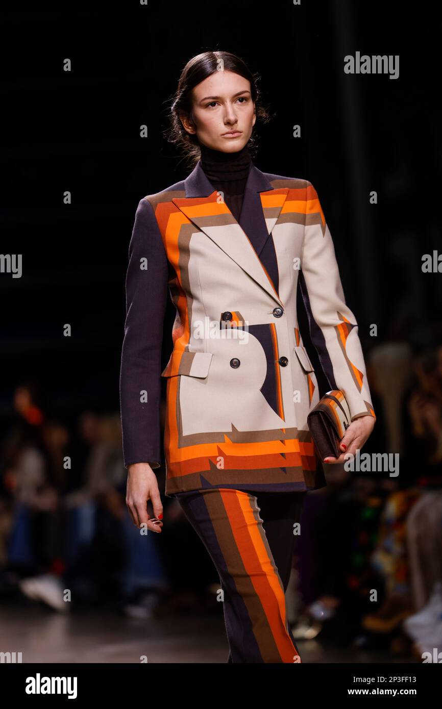 A model wears a creation as part of the Akris Fall/Winter 2023-2024 ...