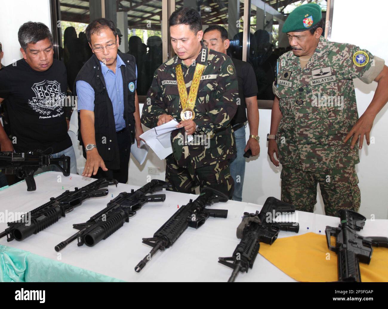 In this photo released by the Armed Forces of the Philippines, Armed ...